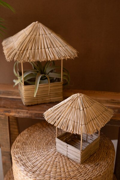 set of 2 seagrass and iron tiki hut planters