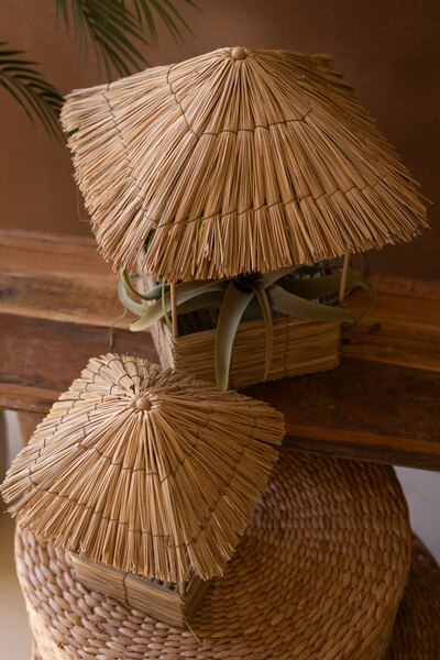 set of 2 seagrass and iron tiki hut planters