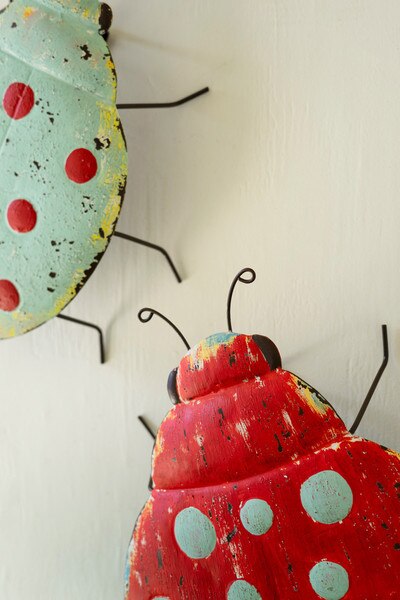 set of 2 painted metal lady bug wall art
