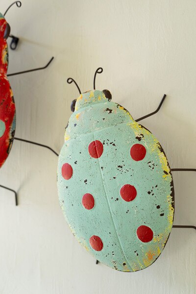 set of 2 painted metal lady bug wall art