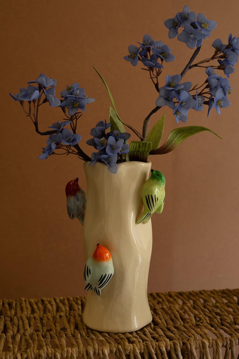 ceramic log vase with colorful birds