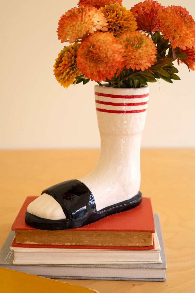 ceramic slide with socks vase