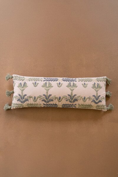 blue embroidered lumbar pillow with tassels